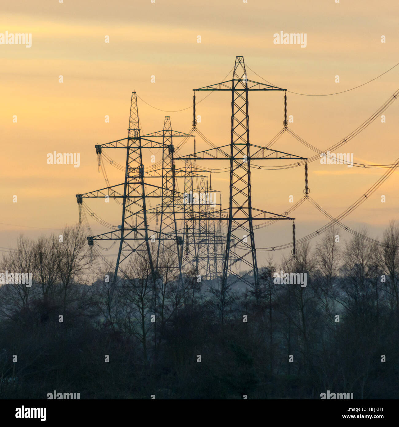 National grid pylons crossing rural, suburban and industrial areas ...