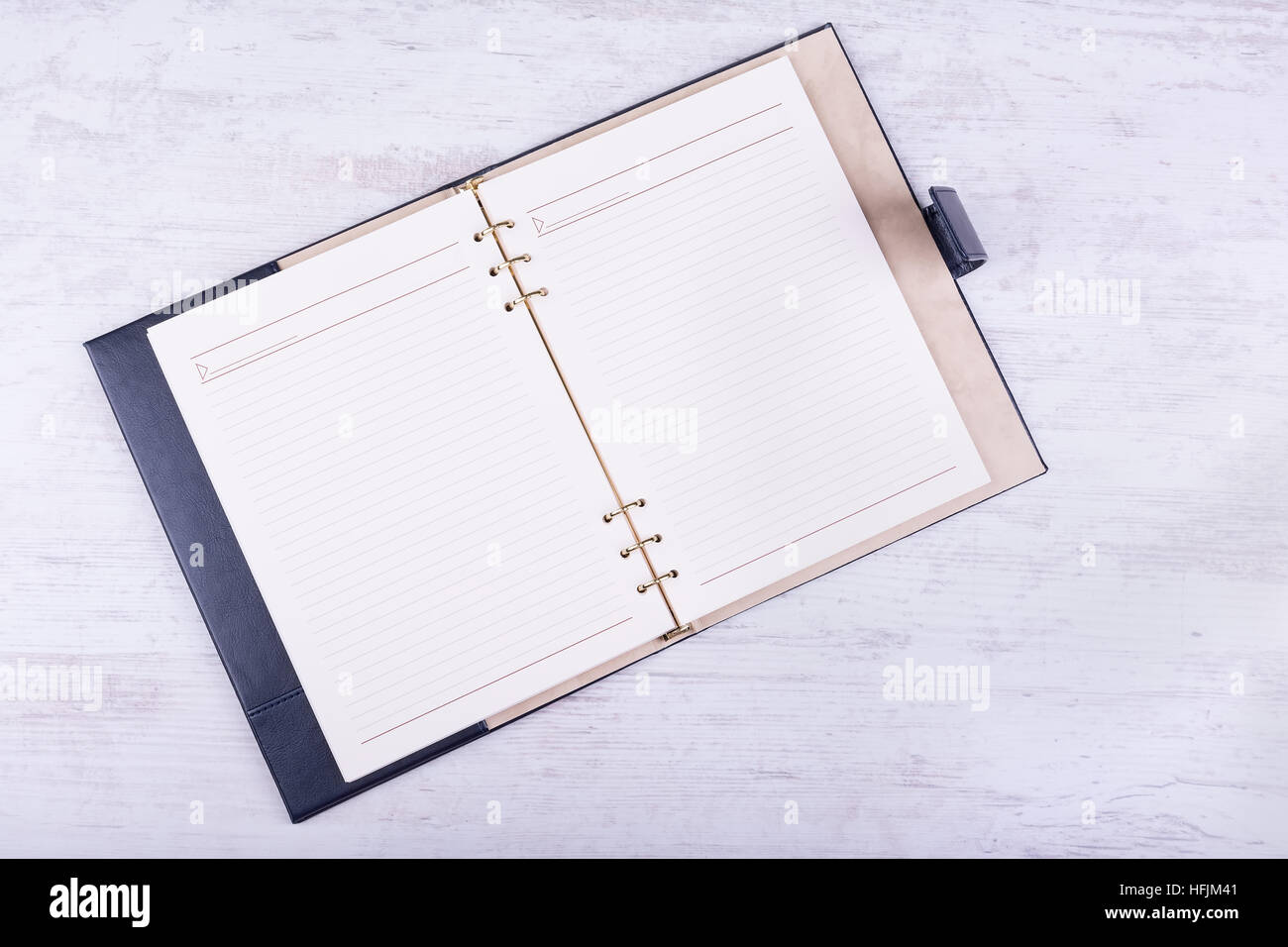 Opened leather notebook on white wooden background Stock Photo - Alamy