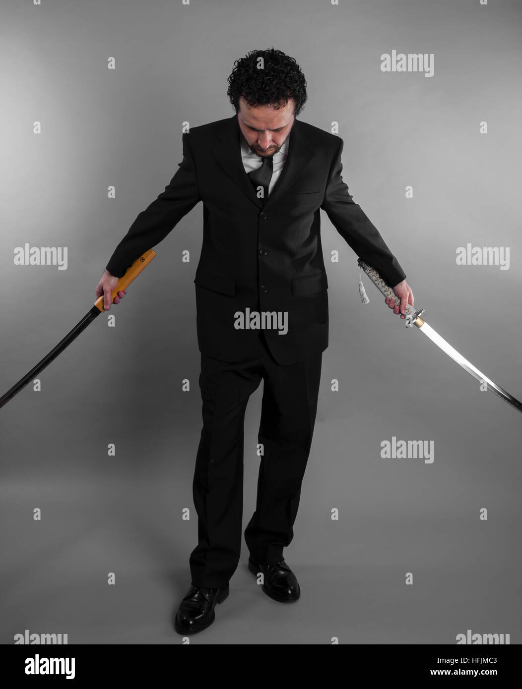 Leadership, Aggressive businessman with Japanese swords in defensive ...
