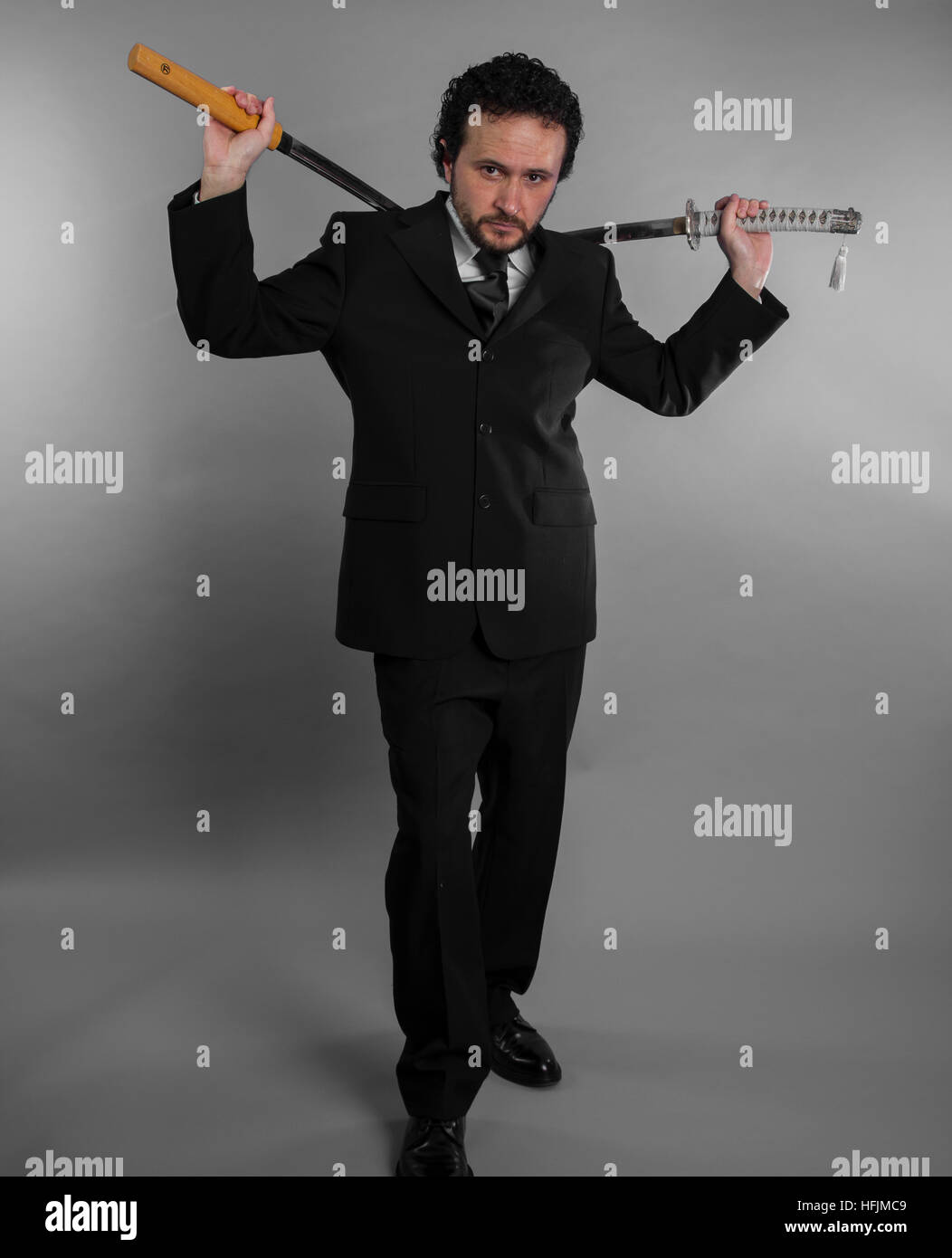 Aggressive businessman with Japanese swords in defensive and defensive ...