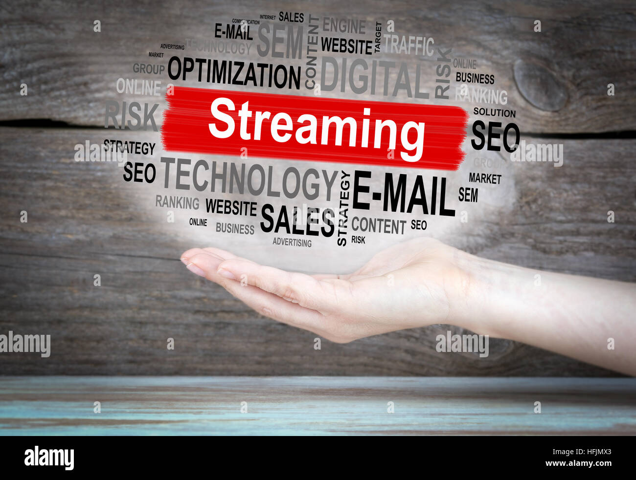 Streaming concept. Word cloud in female hand Stock Photo - Alamy