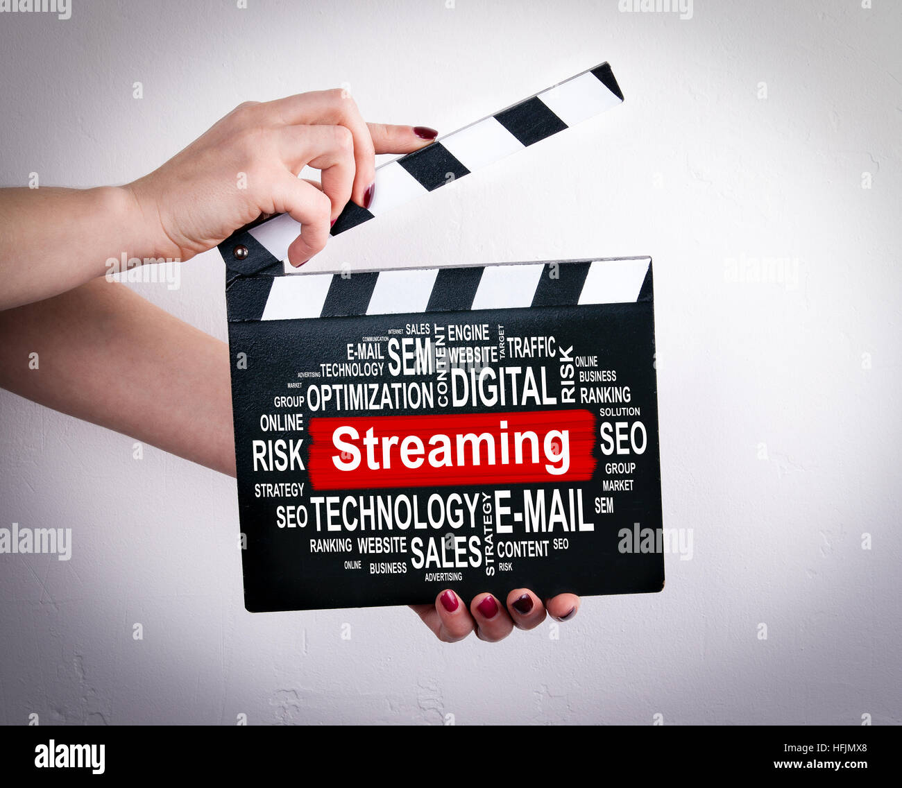 Streaming concept. Female hands holding movie clapper Stock Photo - Alamy