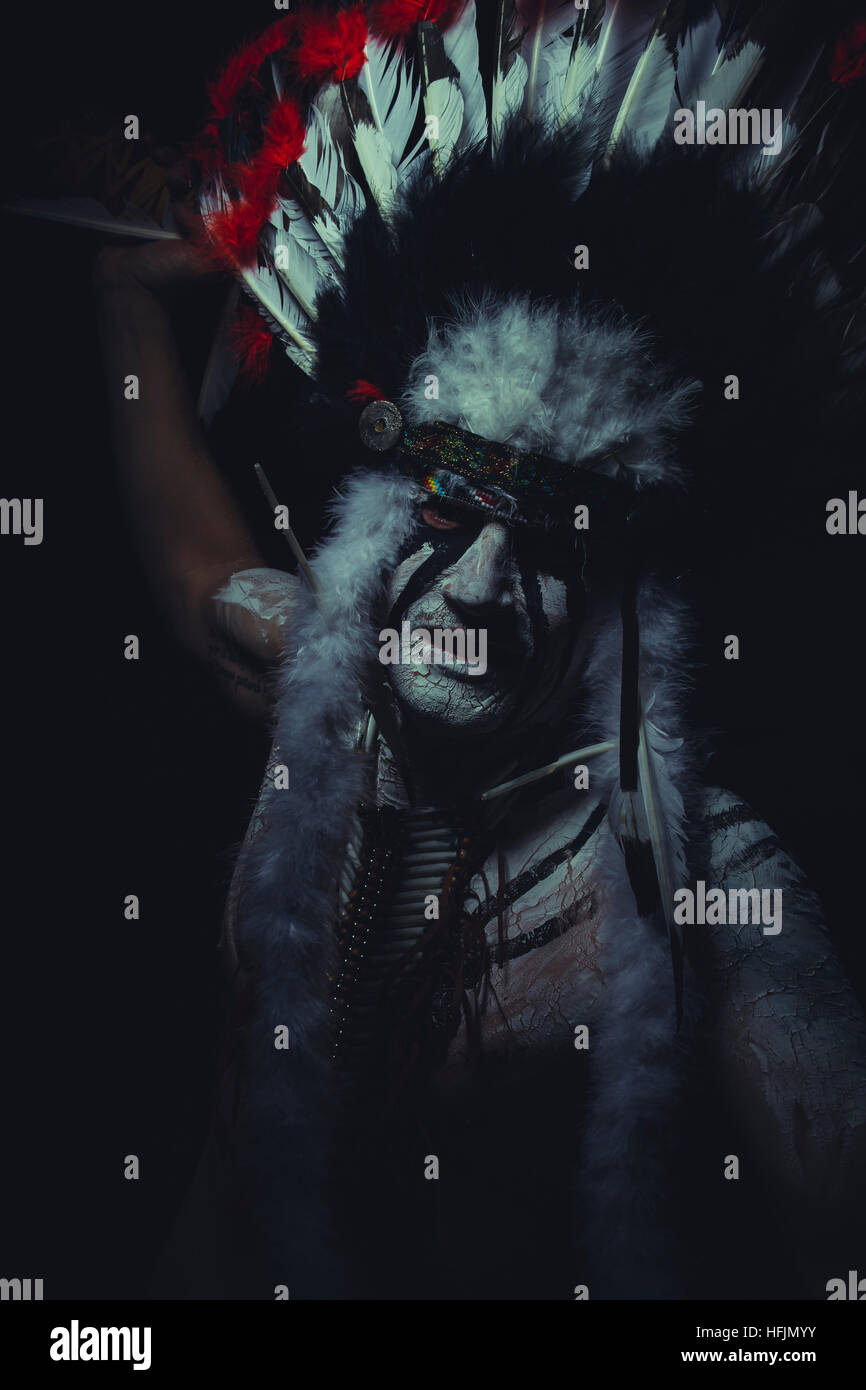 West, American Indian chief with feather headdress and traditional war ...