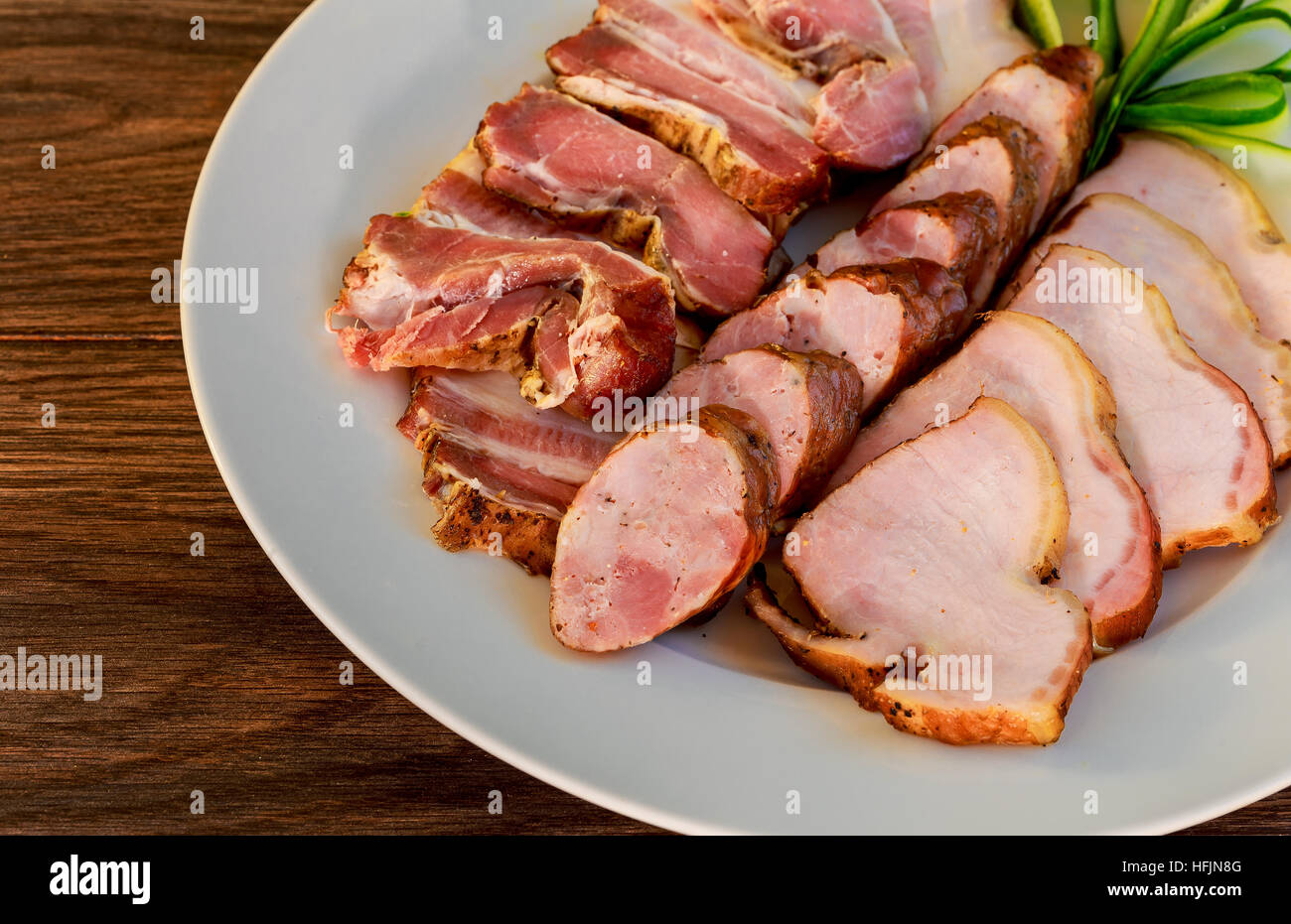 sliced pork pork sausage sliced ham bacon wooden textured table in ...