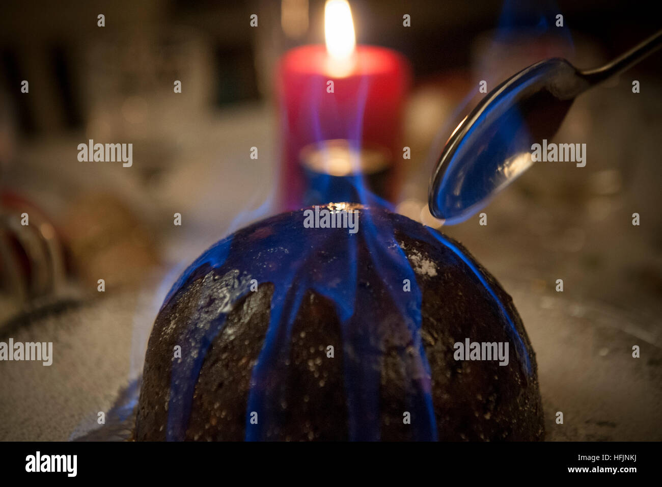 Christmas pudding with brandy alight on it Stock Photo - Alamy