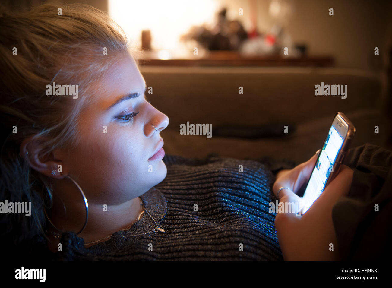 A teenage girl checks her phone Stock Photo - Alamy