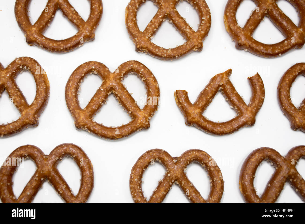different concept - one eaten pretzel among a lot of perfect pretzels ...