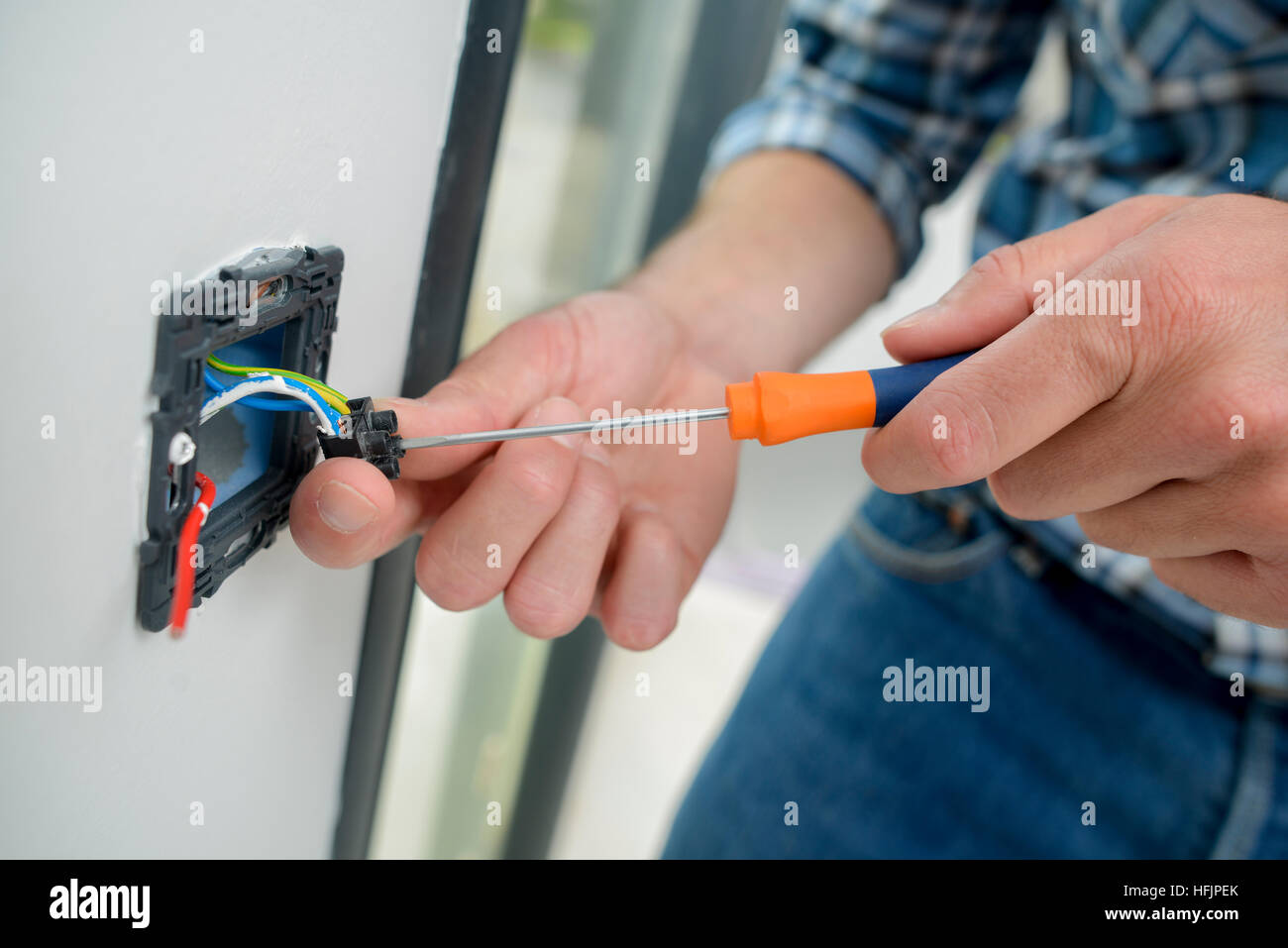 Man doing electrics hi-res stock photography and images - Alamy