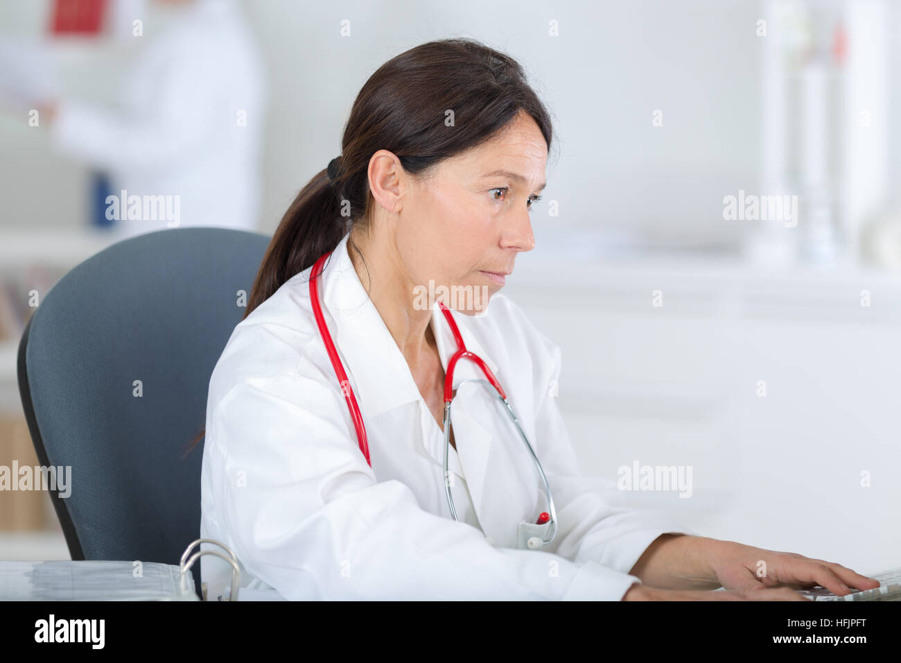 female medical worker using computer Stock Photo - Alamy
