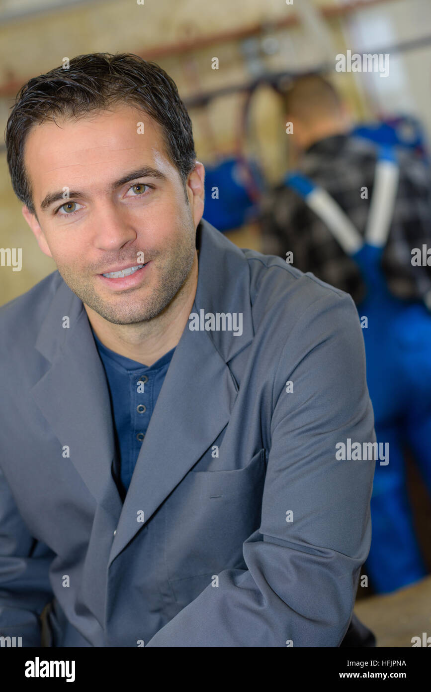 manager in the workshop posing Stock Photo - Alamy