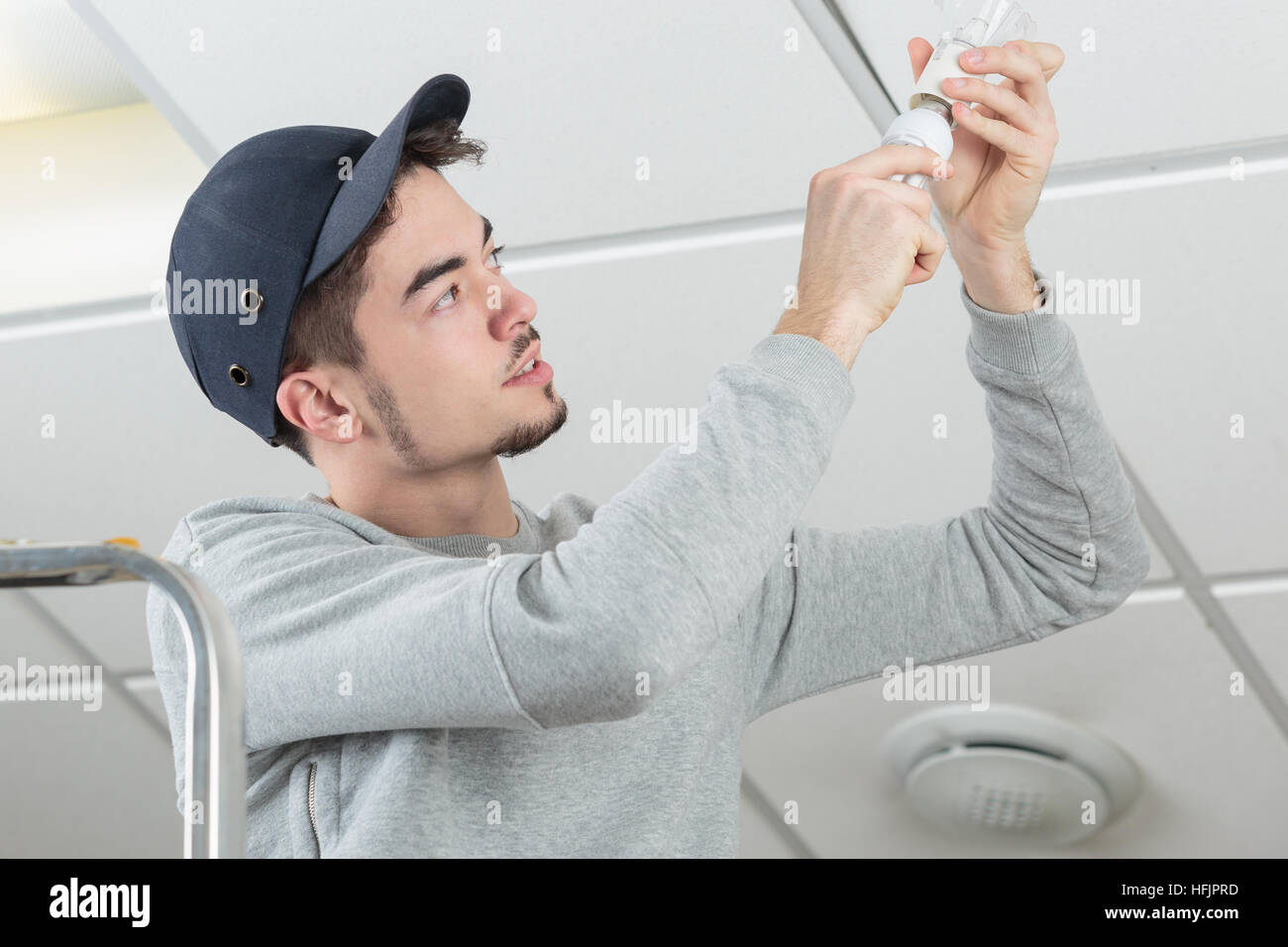 Man changing bulb Stock Photo - Alamy