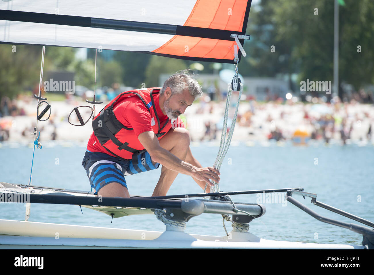 professional waterman training on lake with catamaran Stock Photo - Alamy