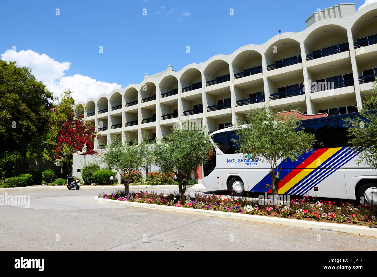 The modern bus for tourists transportation is near entrance to hotel ...