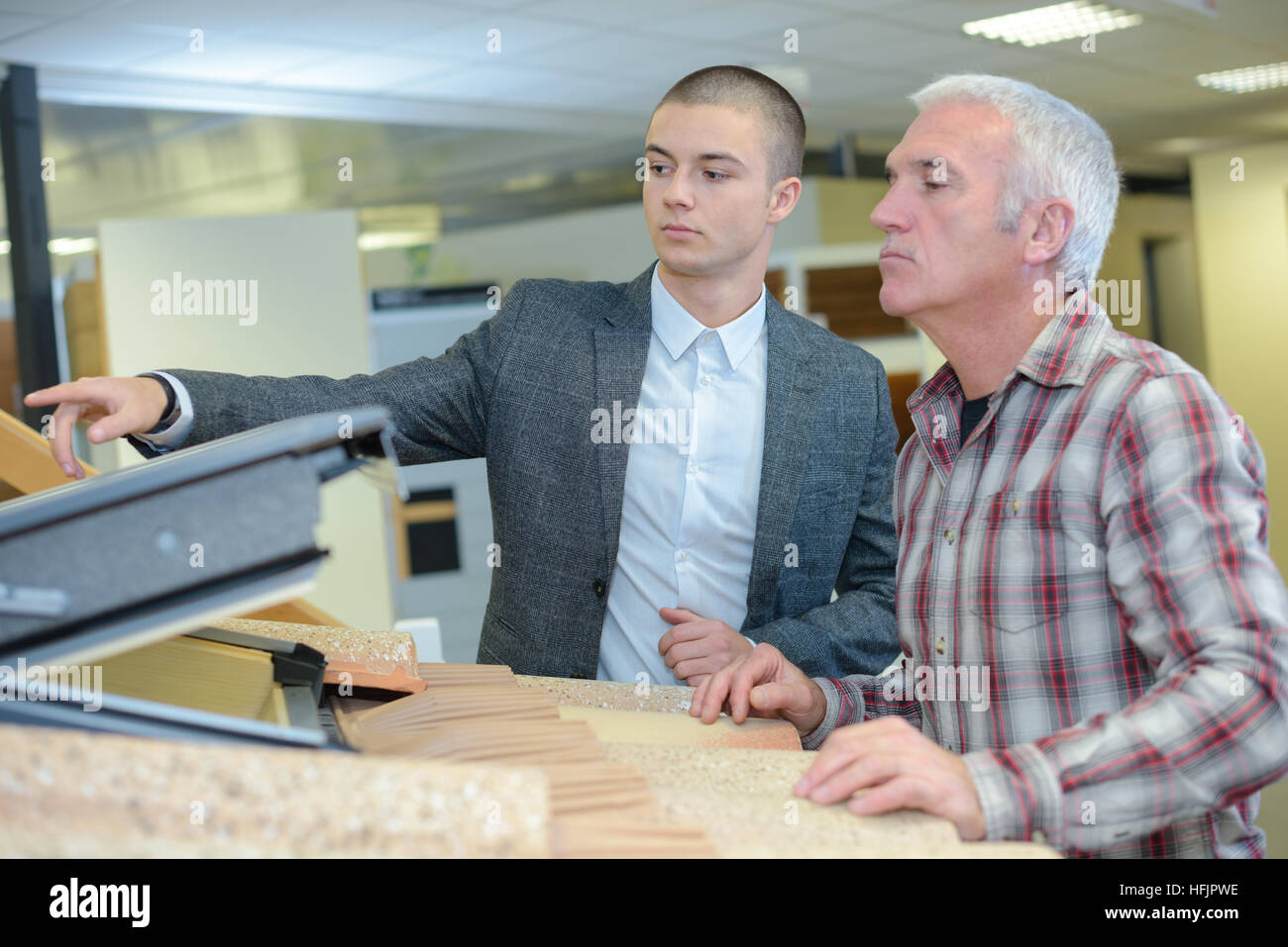 pointing at a product Stock Photo - Alamy