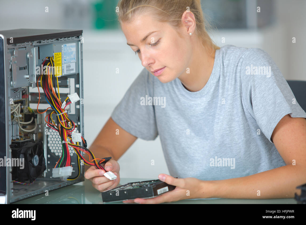Computer technician working on computer Stock Photo - Alamy