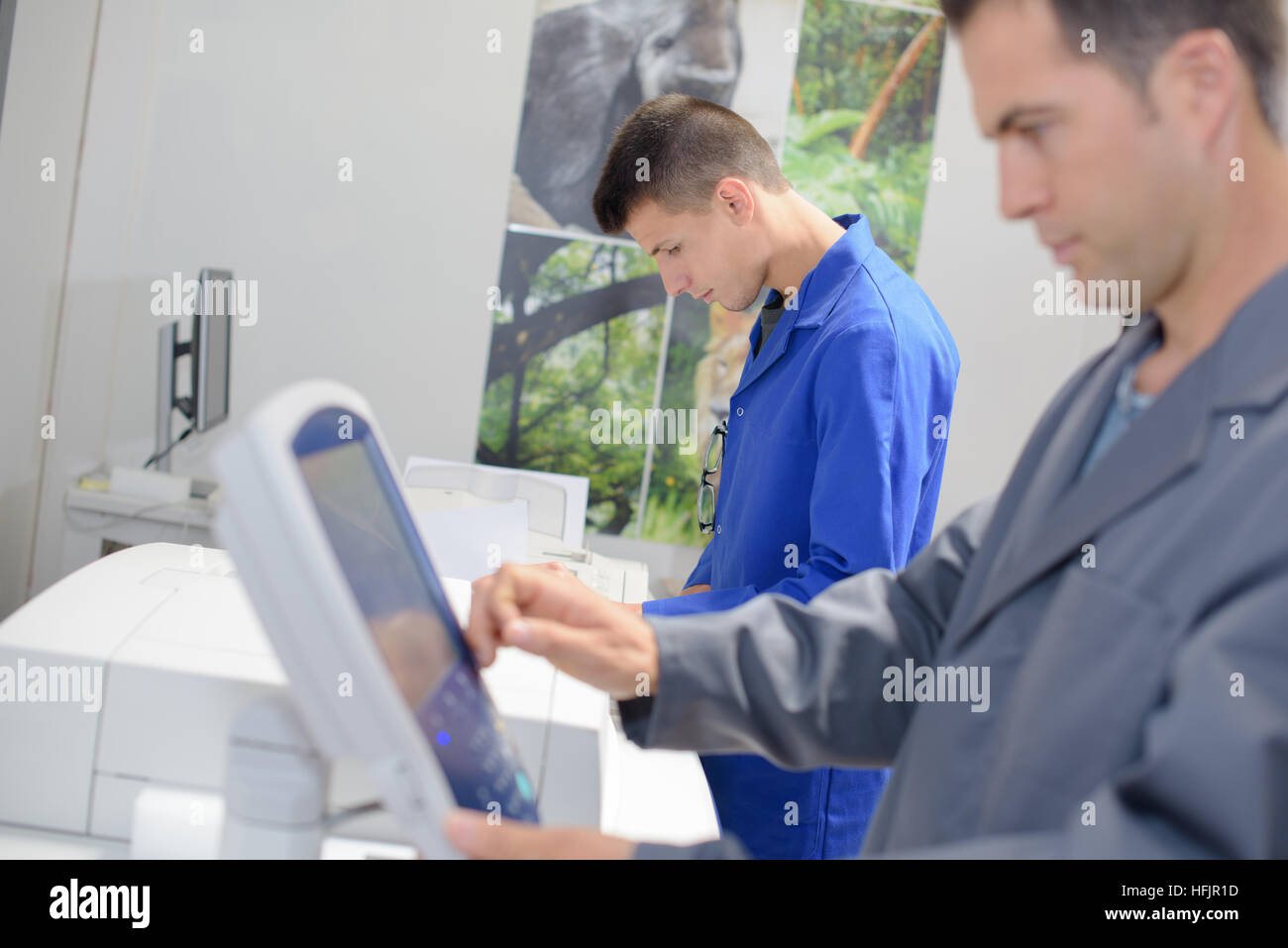 Man entering information into electronic control pad Stock Photo - Alamy