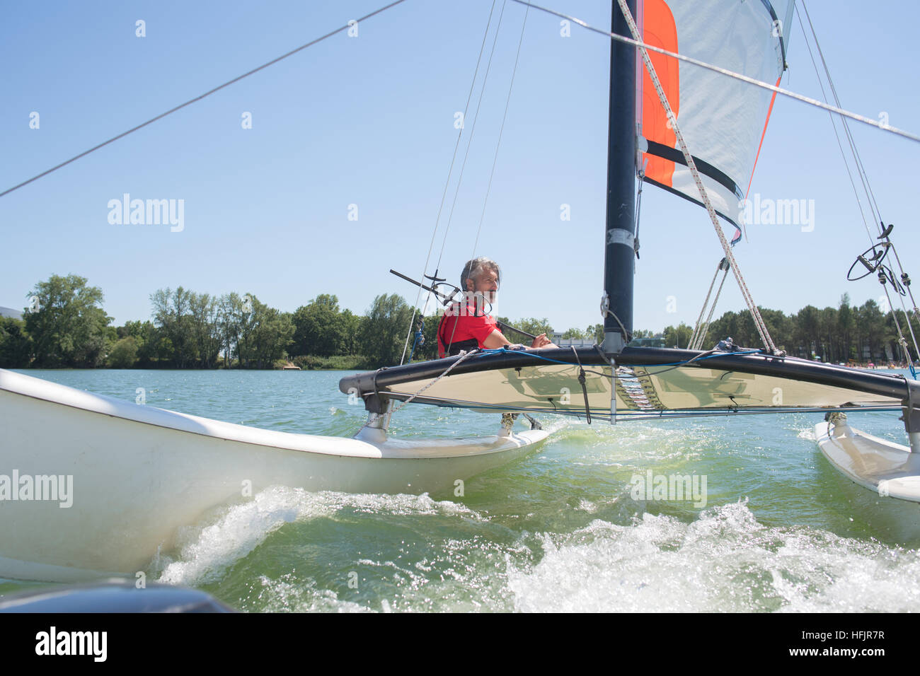 enjoying extreme sailing with racing sailboat Stock Photo - Alamy