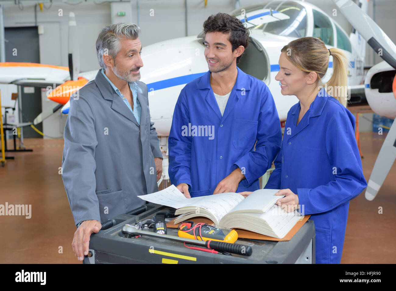 reading the book of manual Stock Photo - Alamy