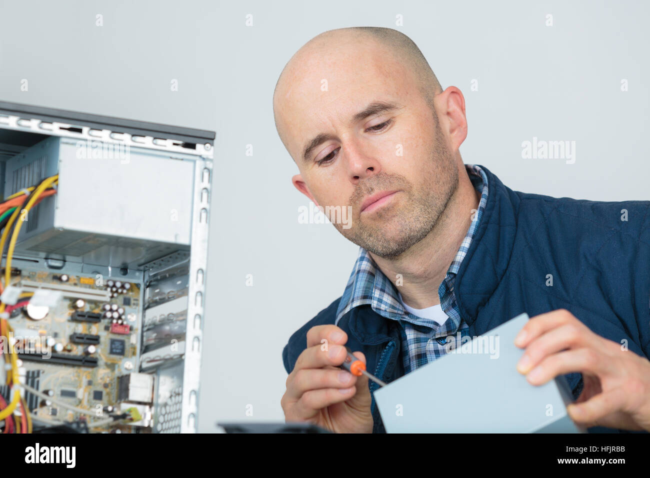 Man repairing computer Stock Photo - Alamy