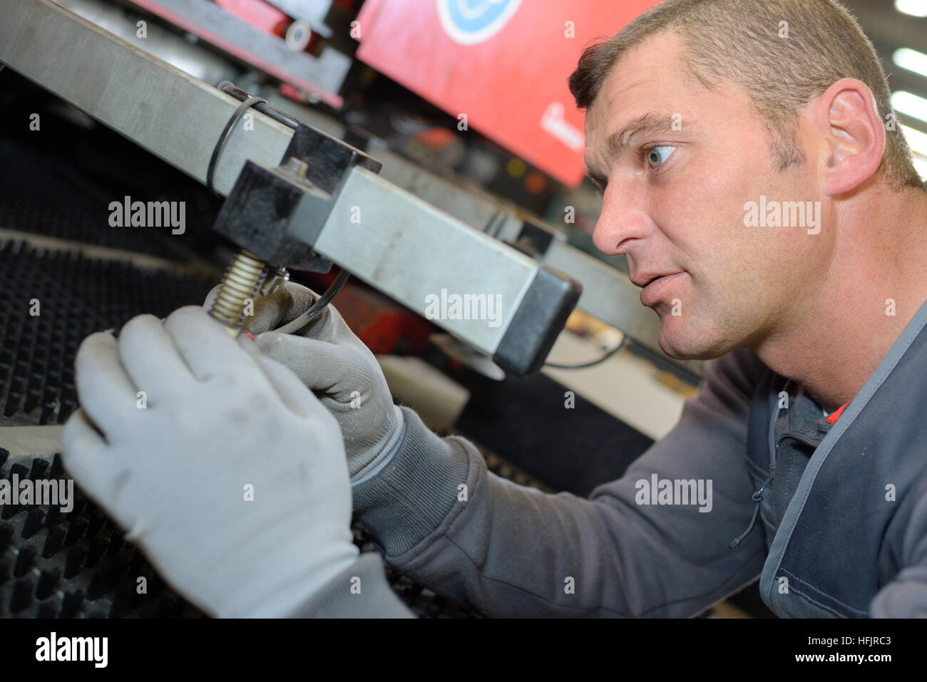 fixing a machine Stock Photo - Alamy