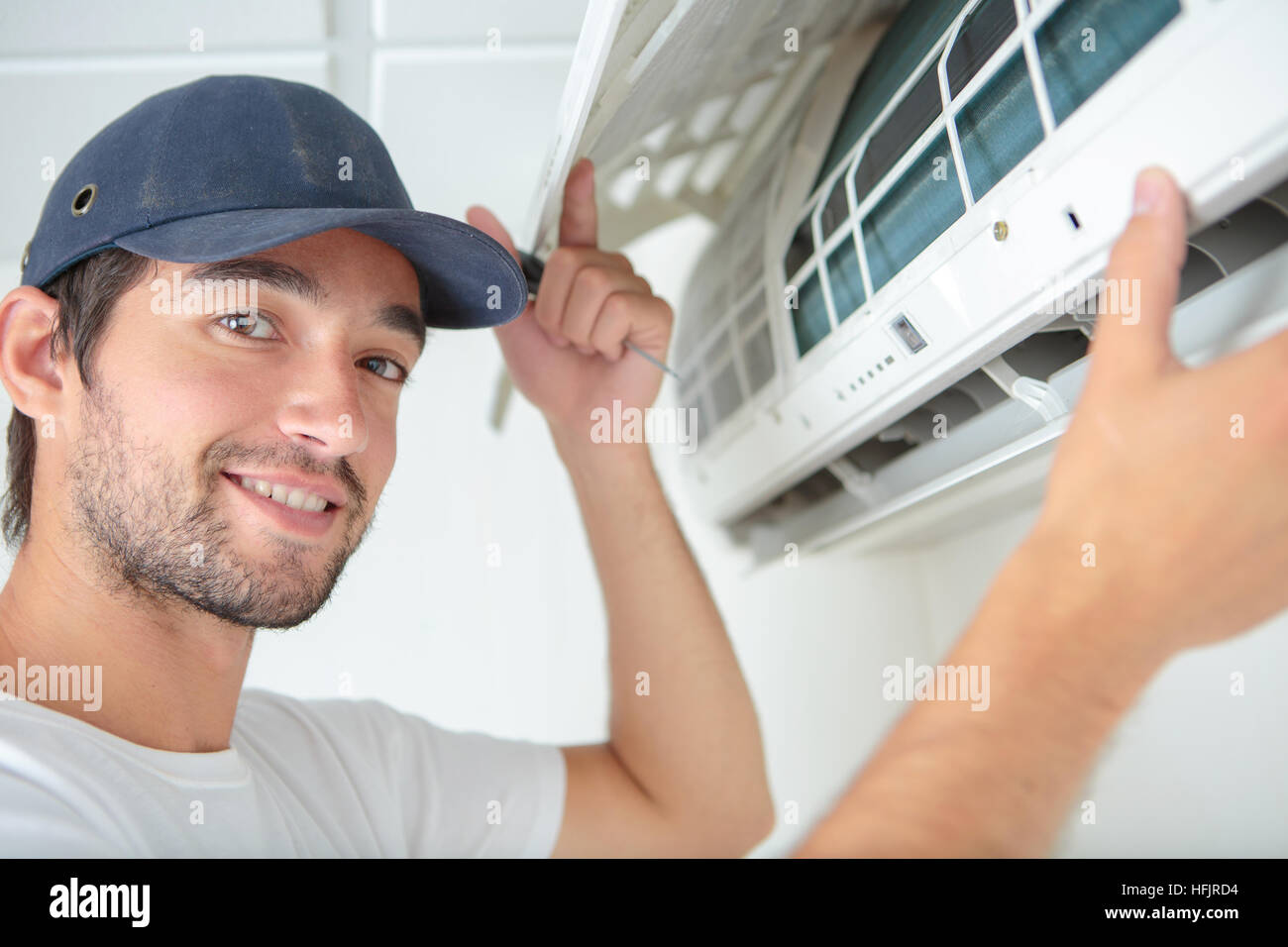 Portrait of air conditioning serviceman Stock Photo - Alamy