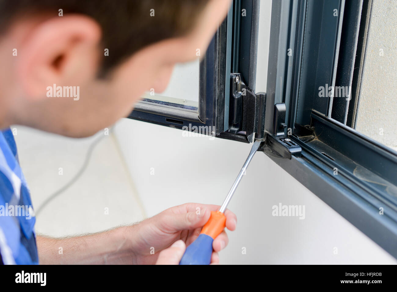 Screwing window frame Stock Photo - Alamy