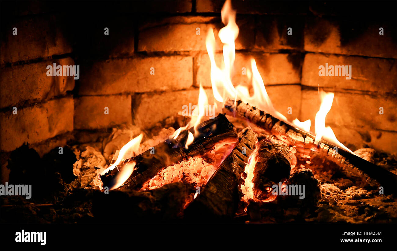 Burning flame fire in a fireplace. Warm and cozy Stock Photo - Alamy