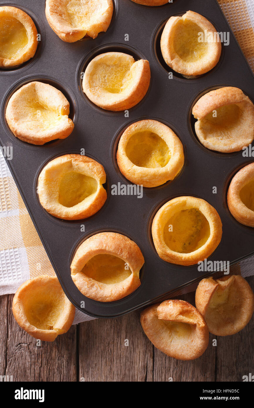 delicious Yorkshire puddings in baking dish closeup. vertical top view ...