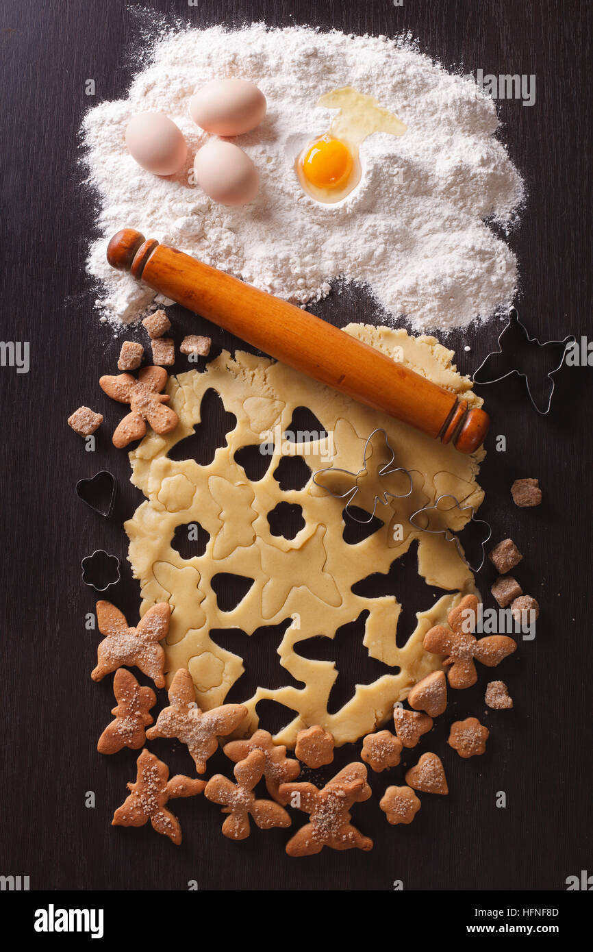 Cooking figure pastry on the table and ingredients. vertical top view ...