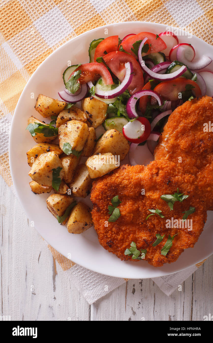 Homemade breaded German Weiner schnitzel with potatoes close-up ...