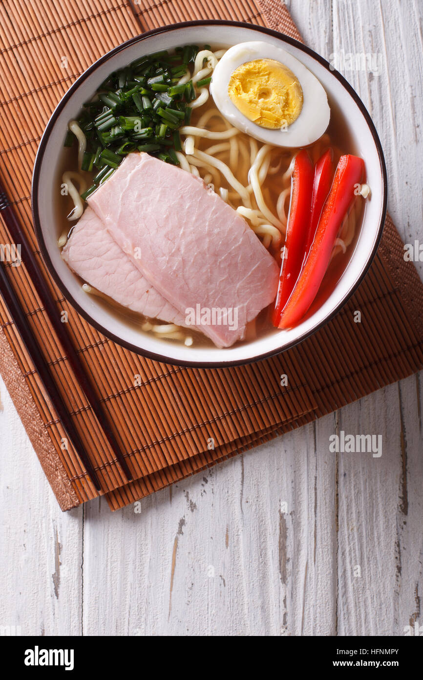 Asian Food: Ramen noodles in broth with pork, vegetables and egg in a ...