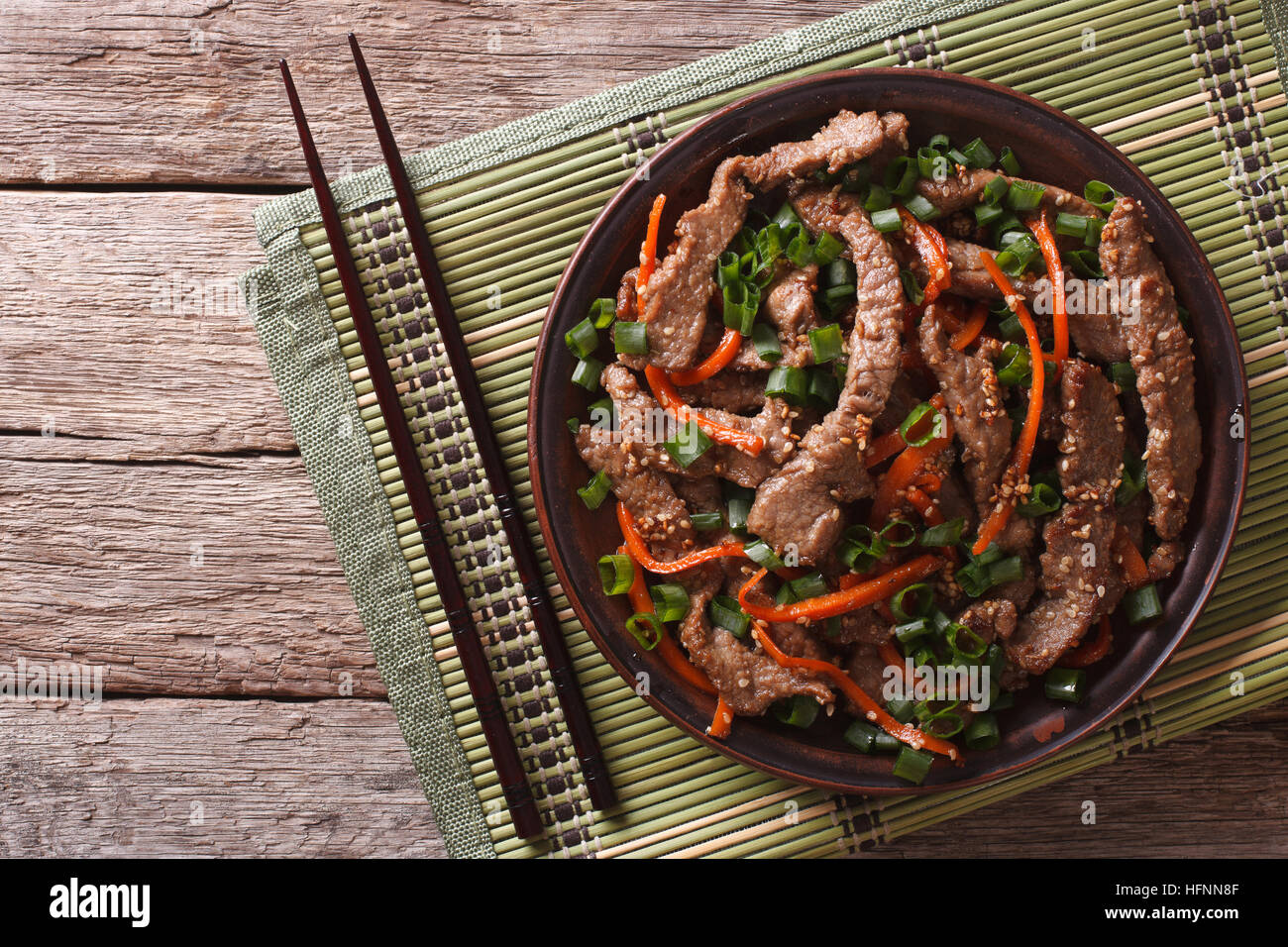 Asian Food: Bulgogi beef slices fried with sesame and carrot on a plate ...