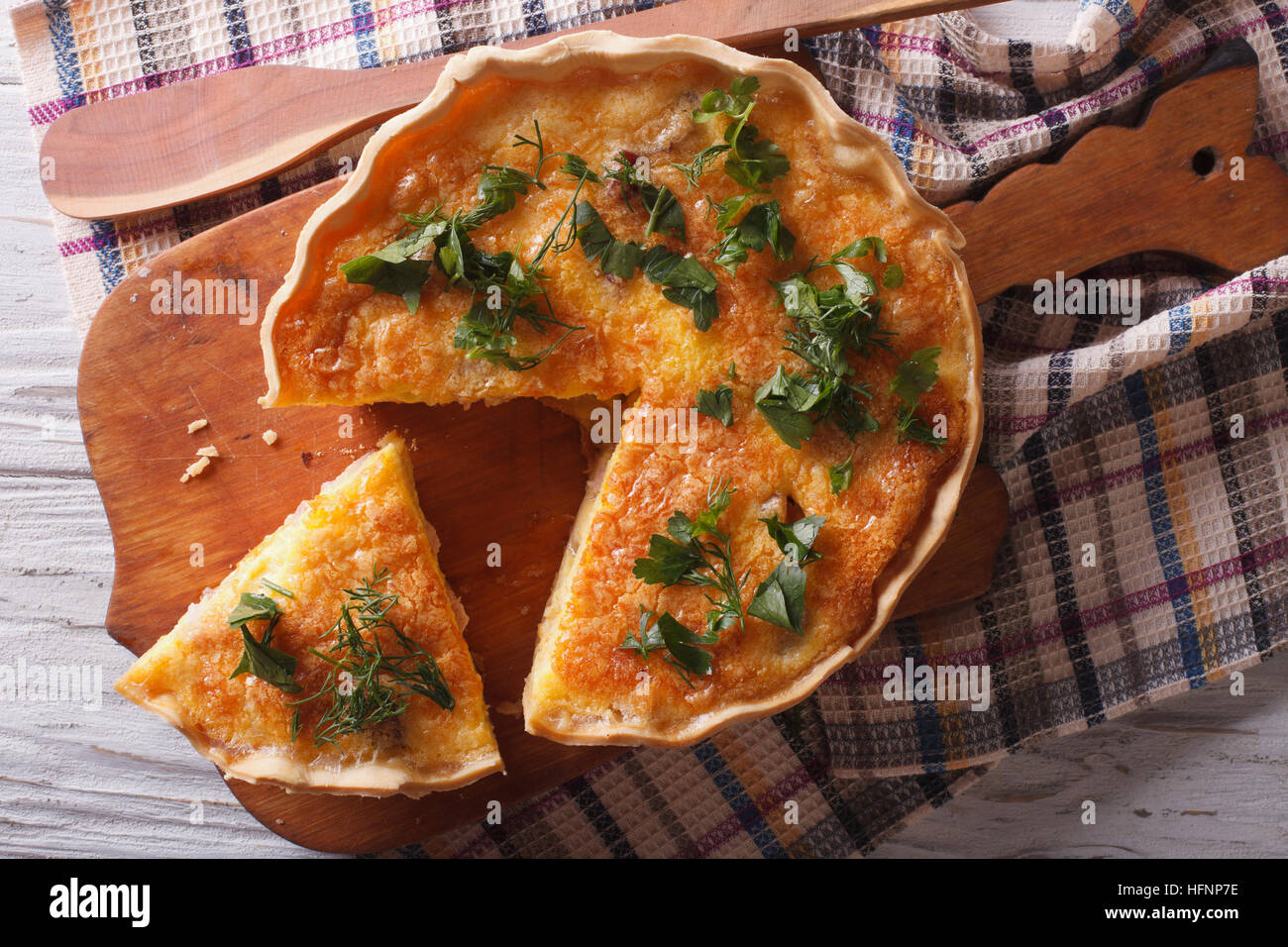 French quiche Lorraine close-up on the table. horizontal view from ...