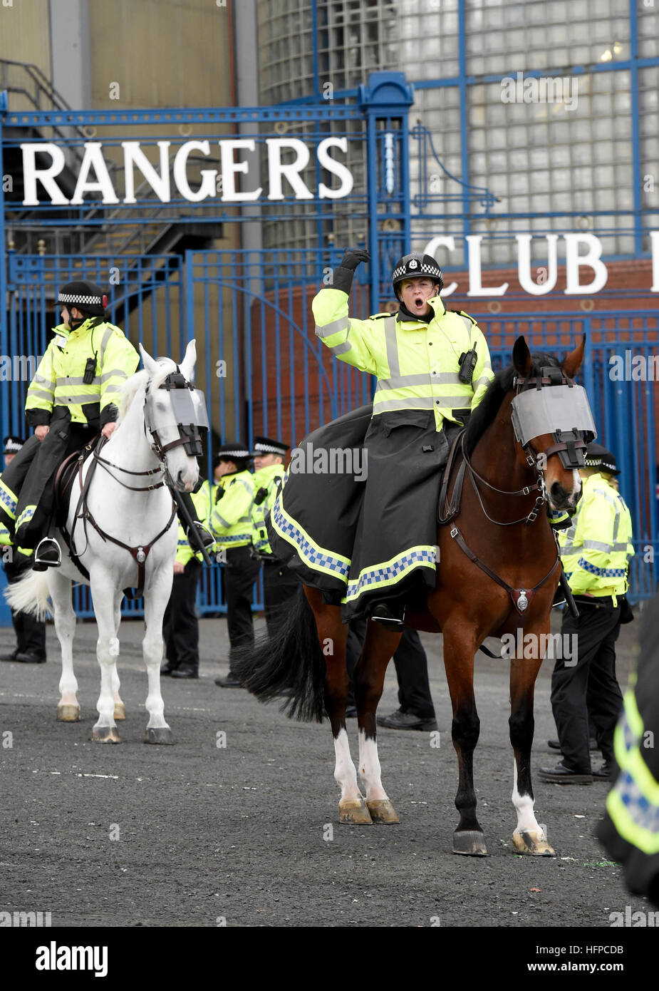 Mounted police direct fans outside Ibrox Stadium before the Ladbrokes ...
