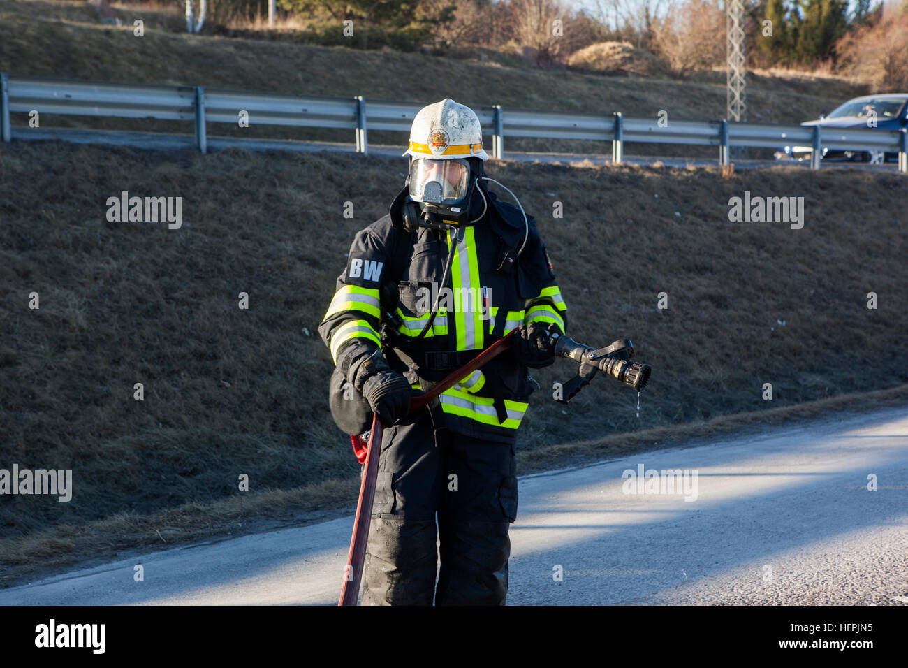 Firefighter with protective equipment Stock Photo - Alamy