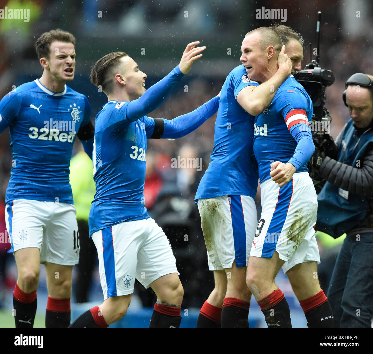 Rangers' Kenny Miller celebrates with team mates after scoring the ...