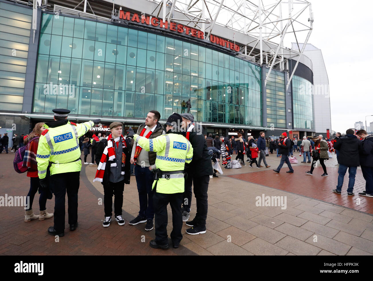 Police give directions to fans outside Old Trafford during the Premier ...