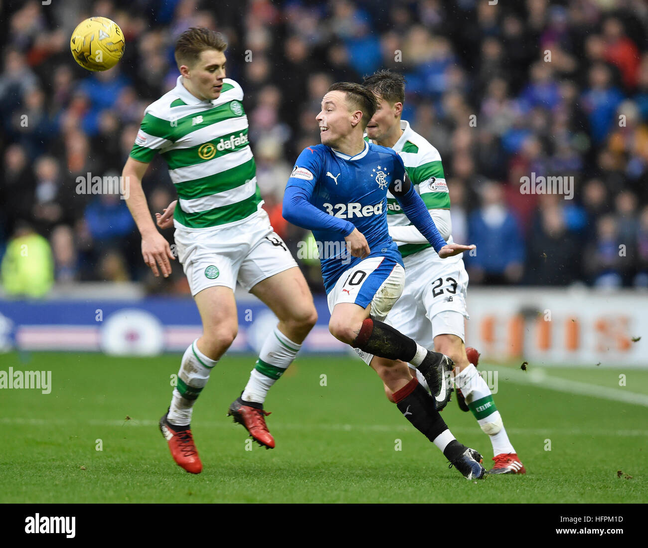 Rangers Barry McKay gets between Celtic"s James Forrest and Mikael ...