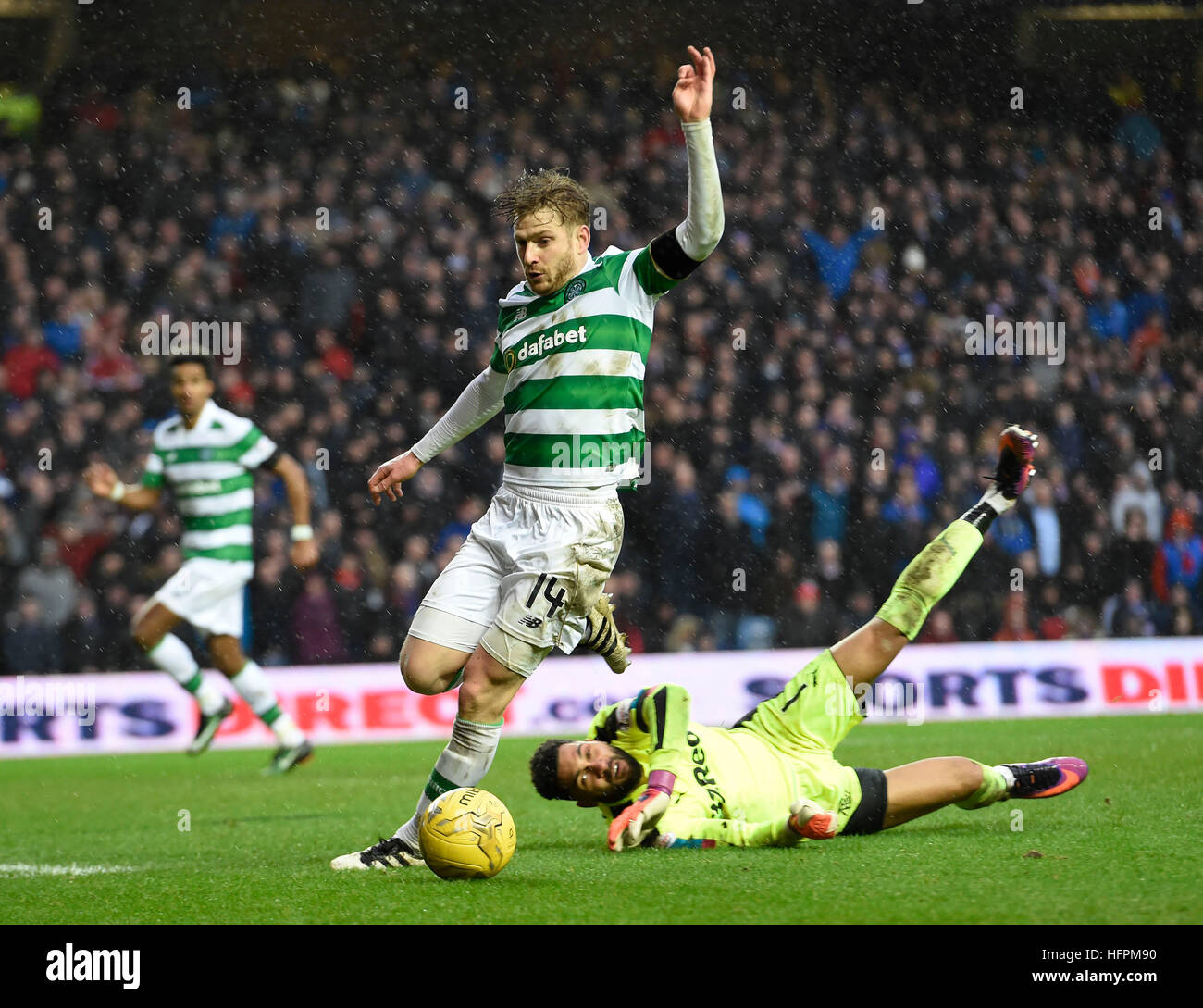Celtic"s Stuart Armstrong rounds Rangers keeper Wes Foderingham during ...