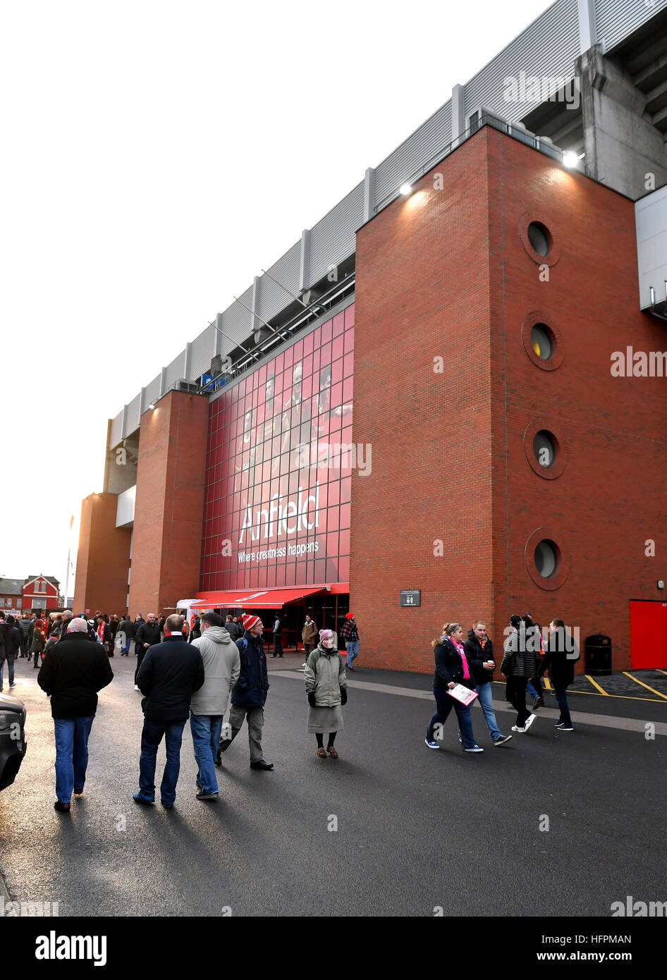 Fans arrive at the ground ahead of the Premier League match at Anfield ...