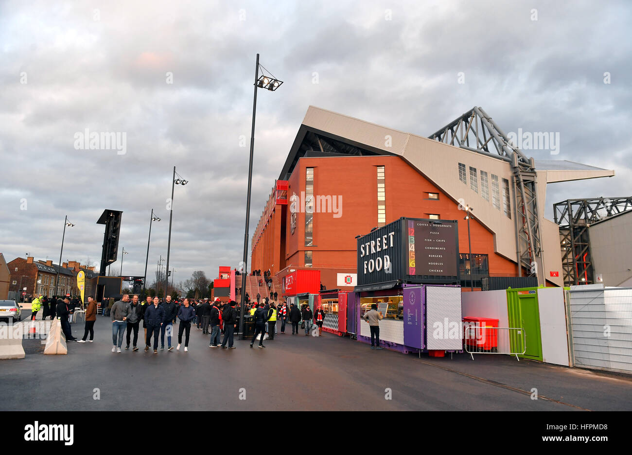Fans arrive at the ground ahead of the Premier League match at Anfield ...