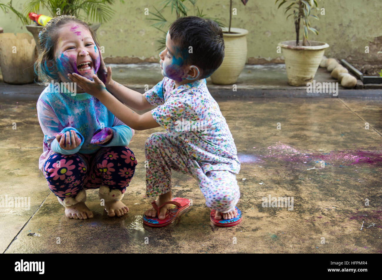 Kids celebrating Holi, the festival of colors Stock Photo - Alamy