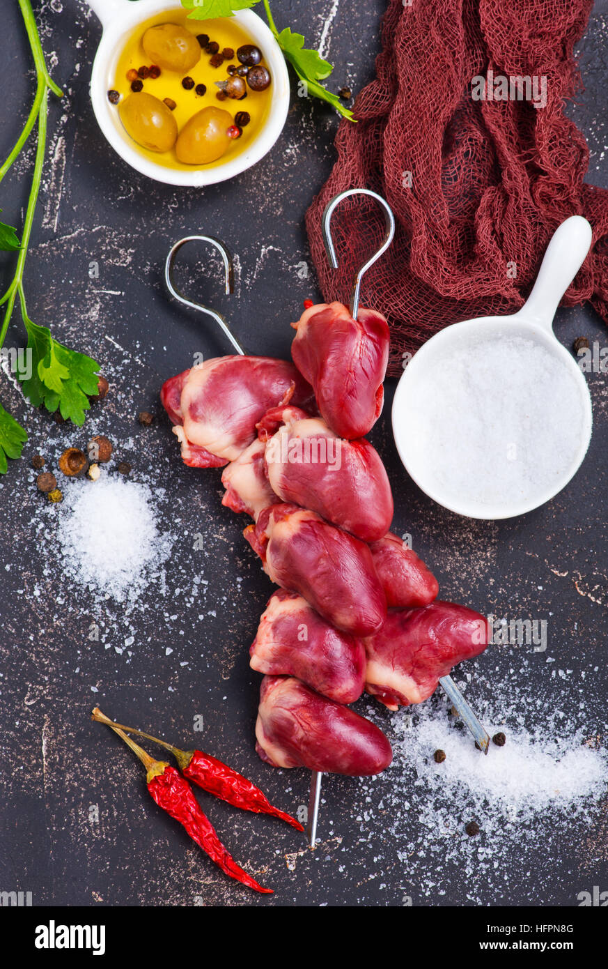 raw duck hearts with spice and salt on a table Stock Photo - Alamy