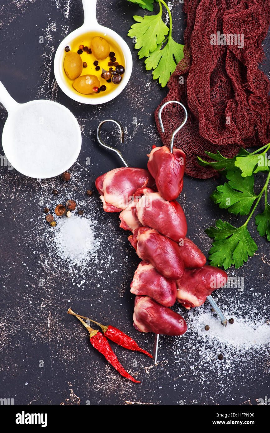 raw duck hearts with spice and salt on a table Stock Photo - Alamy