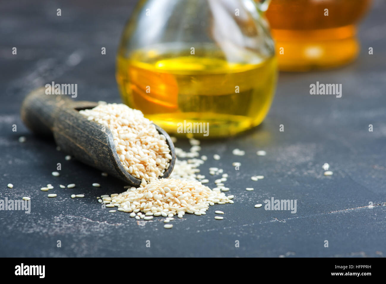 sesame oil in bottle and on a table Stock Photo - Alamy