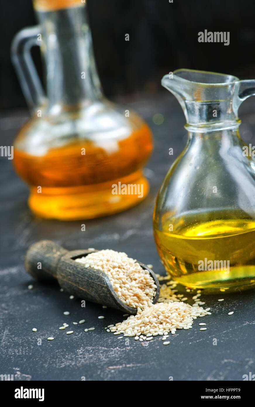 sesame oil in bottle and on a table Stock Photo - Alamy