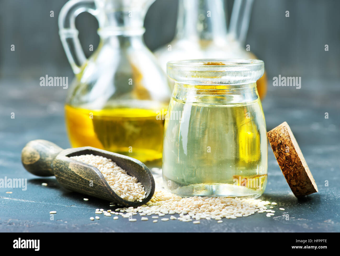 sesame oil in bottle and on a table Stock Photo - Alamy
