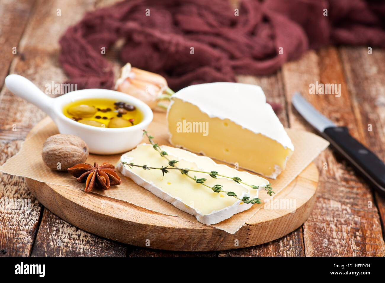 cheese on board and on a table Stock Photo - Alamy