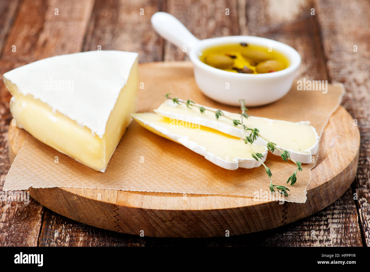 cheese on board and on a table Stock Photo - Alamy