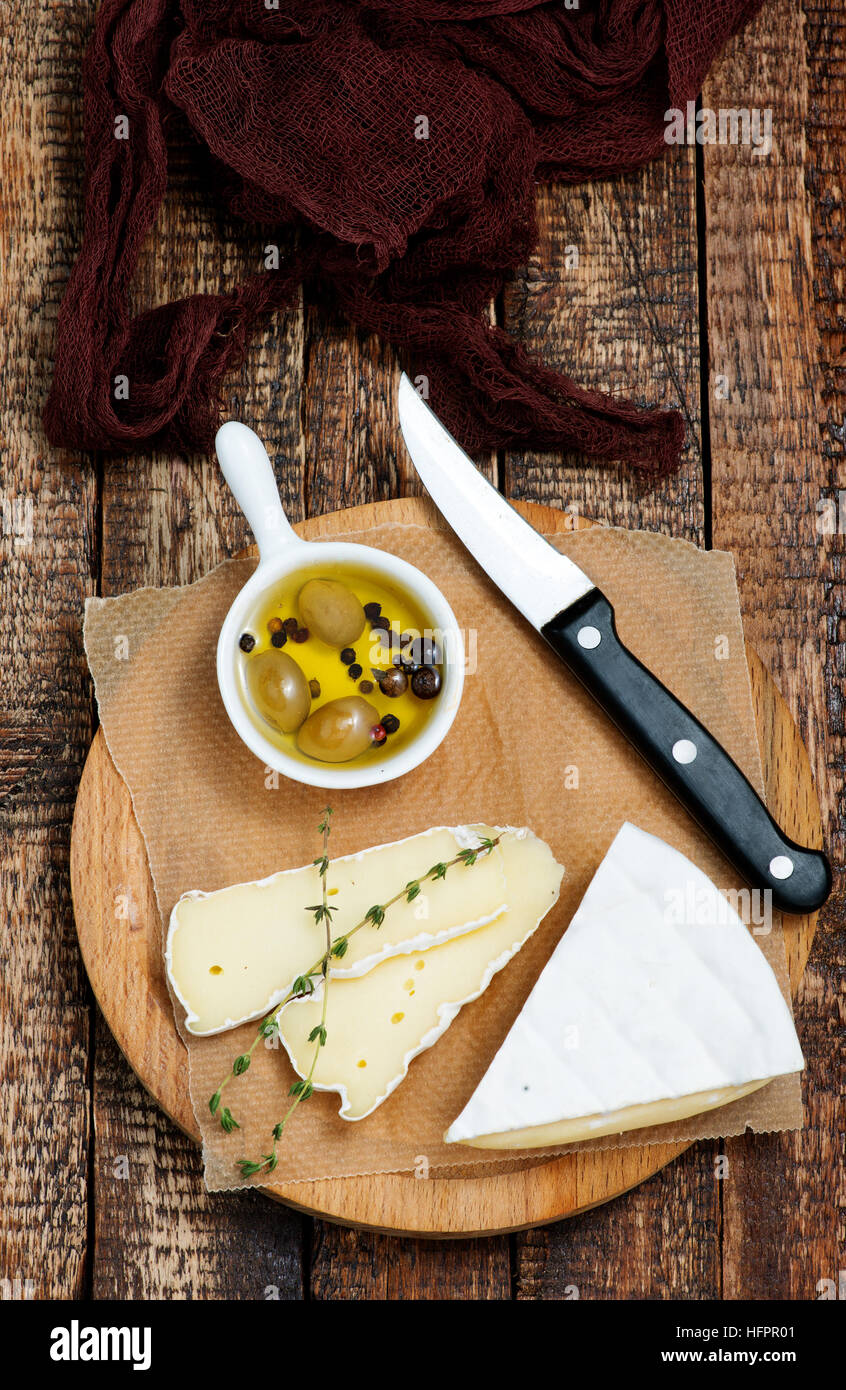 cheese on board and on a table Stock Photo - Alamy